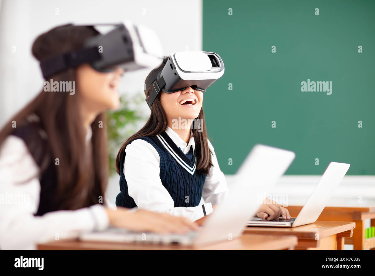 teenagers student with virtual reality headset in classroom Stock Photo ...