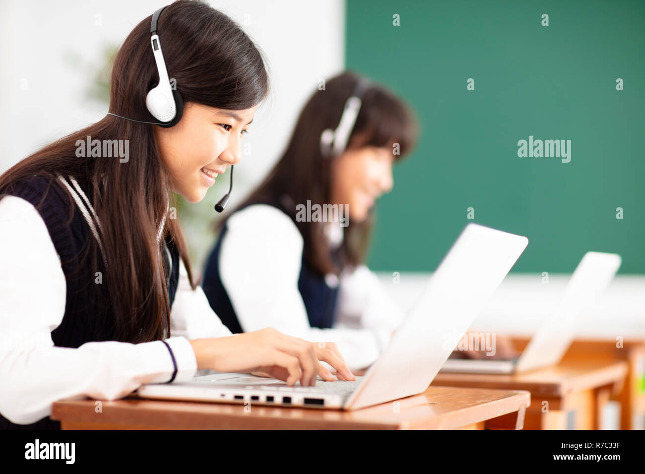 teenager student learning online with headphones and laptop Stock Photo ...