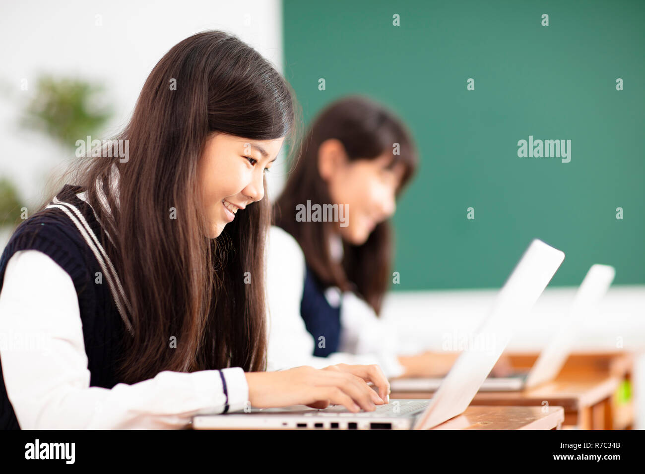 teenager student learning online with laptop in classroom Stock Photo ...