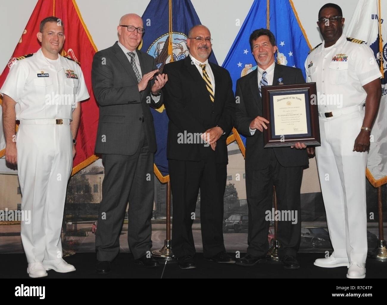DAHLGREN, Va. (May 17, 2017) – Stephen Malyevac holds a framed ...