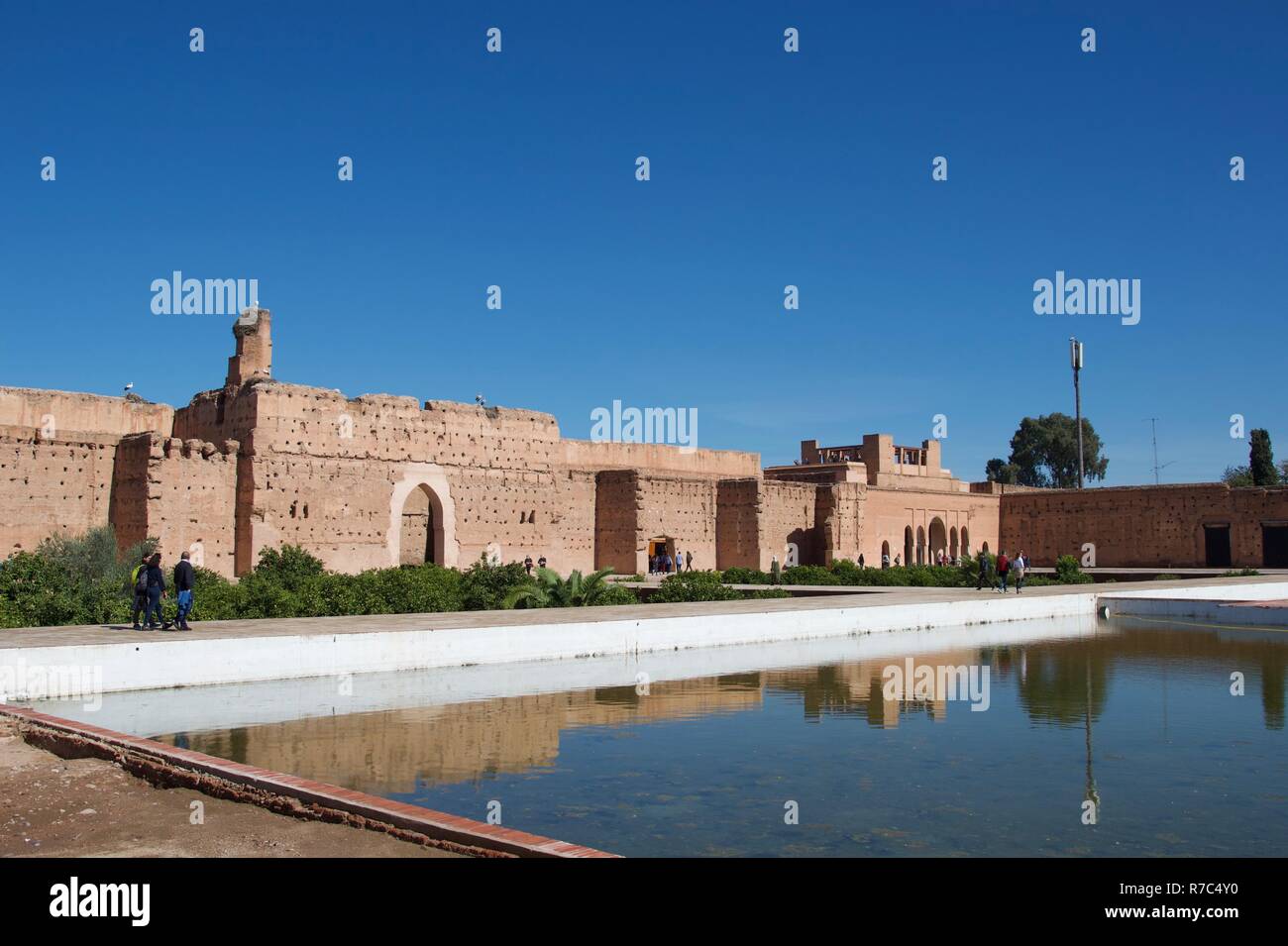 The ancient El Badi palace is reflected in a still pond in Marrakech ...