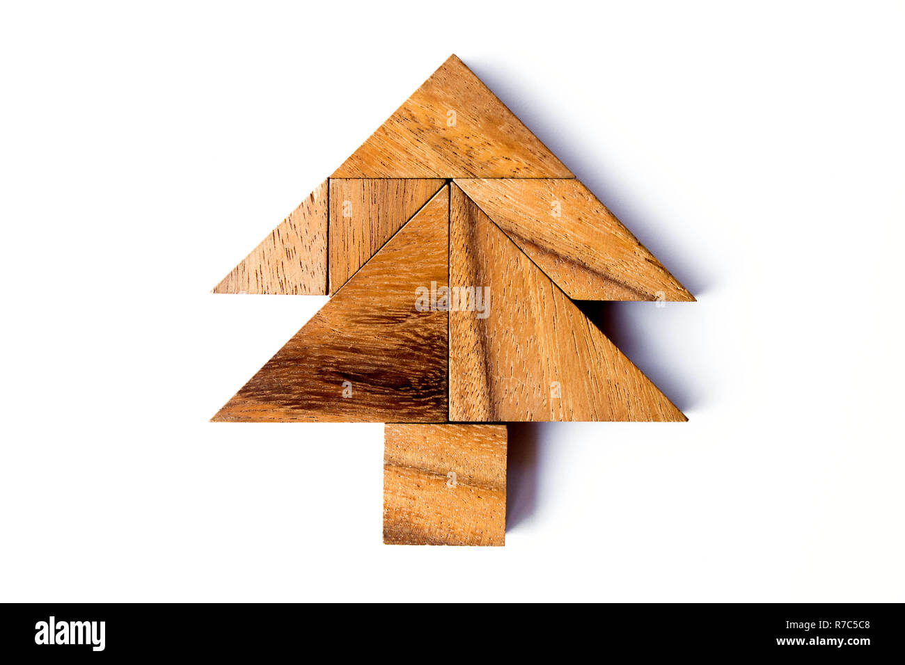 Wood tangram puzzle in tree shape on white background Stock Photo - Alamy