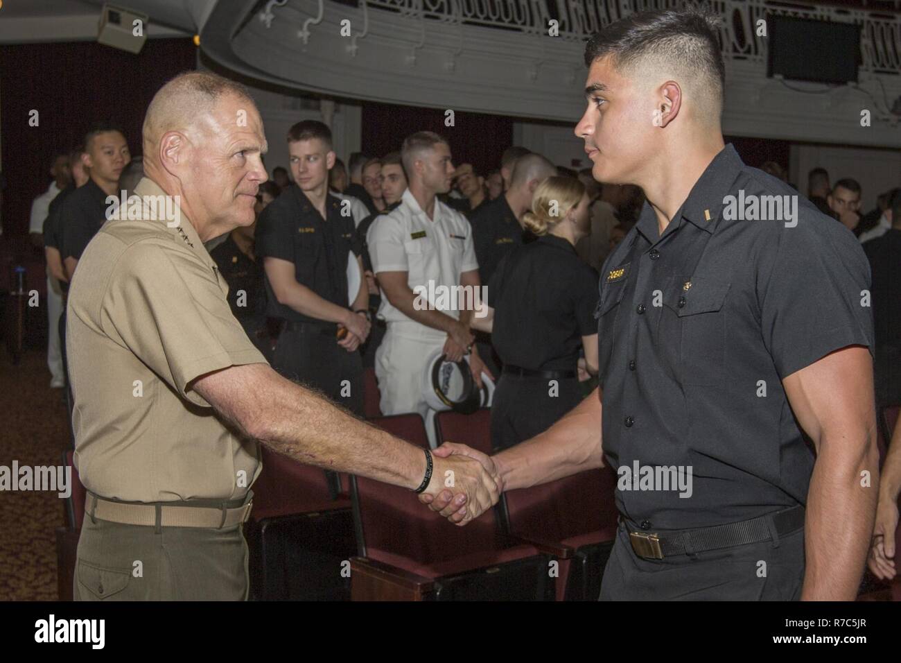Commandant of the Marine Corps Gen. Robert B. Neller shakes hands with ...
