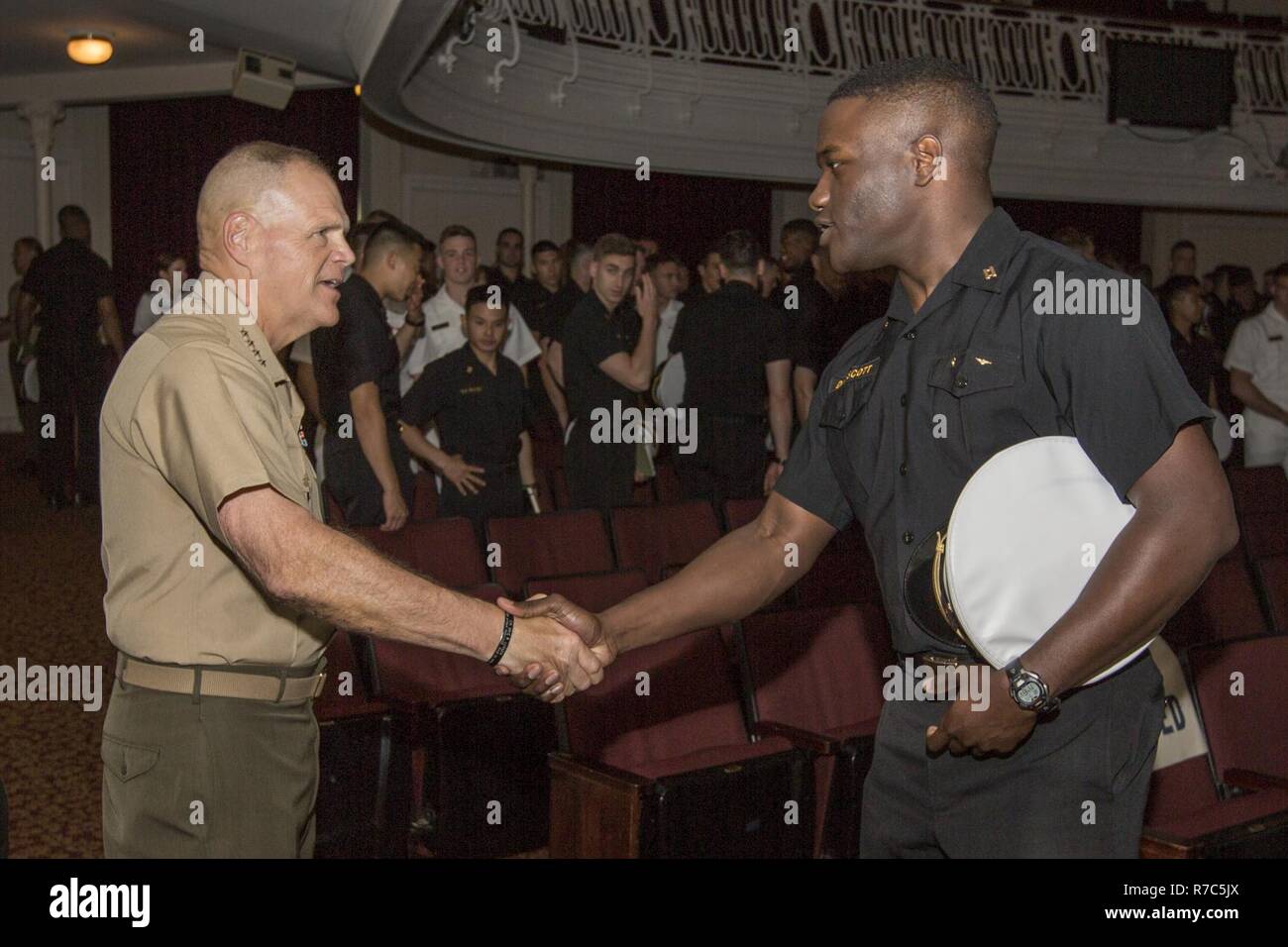Commandant of the Marine Corps Gen. Robert B. Neller shakes hands with ...