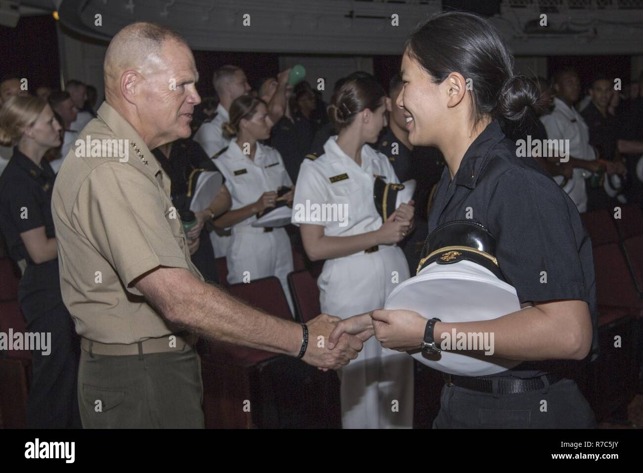 Commandant of the Marine Corps Gen. Robert B. Neller shakes hands with ...