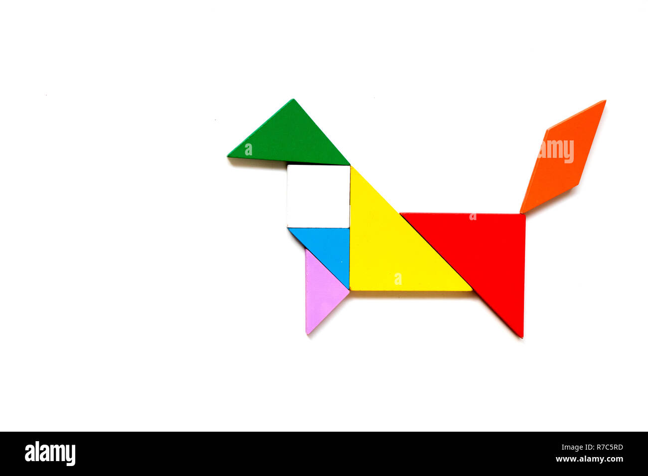Color wood tangram puzzle in dog shape on white background Stock Photo ...