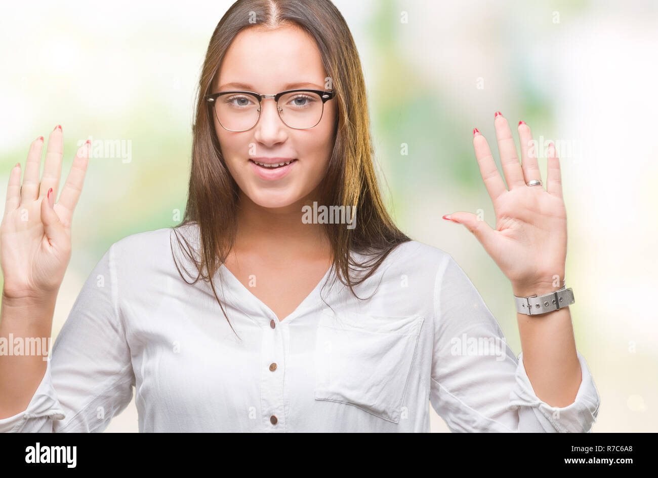 Young caucasian beautiful business woman wearing glasses over isolated ...