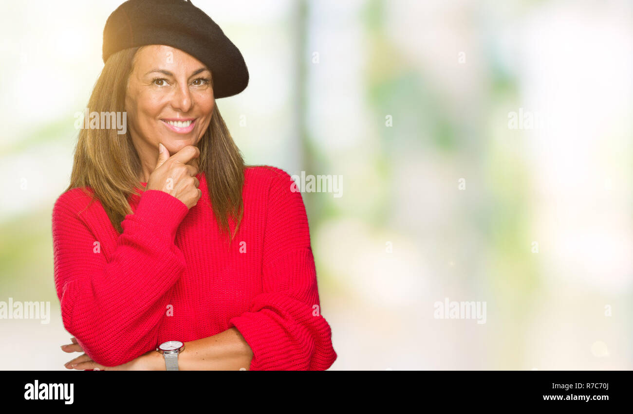 Middle age adult woman wearing fashion beret over isolated background ...