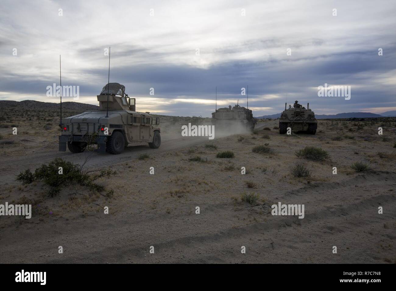 U.S. Marine Corps assault vehicles travel toward a breach site at ...