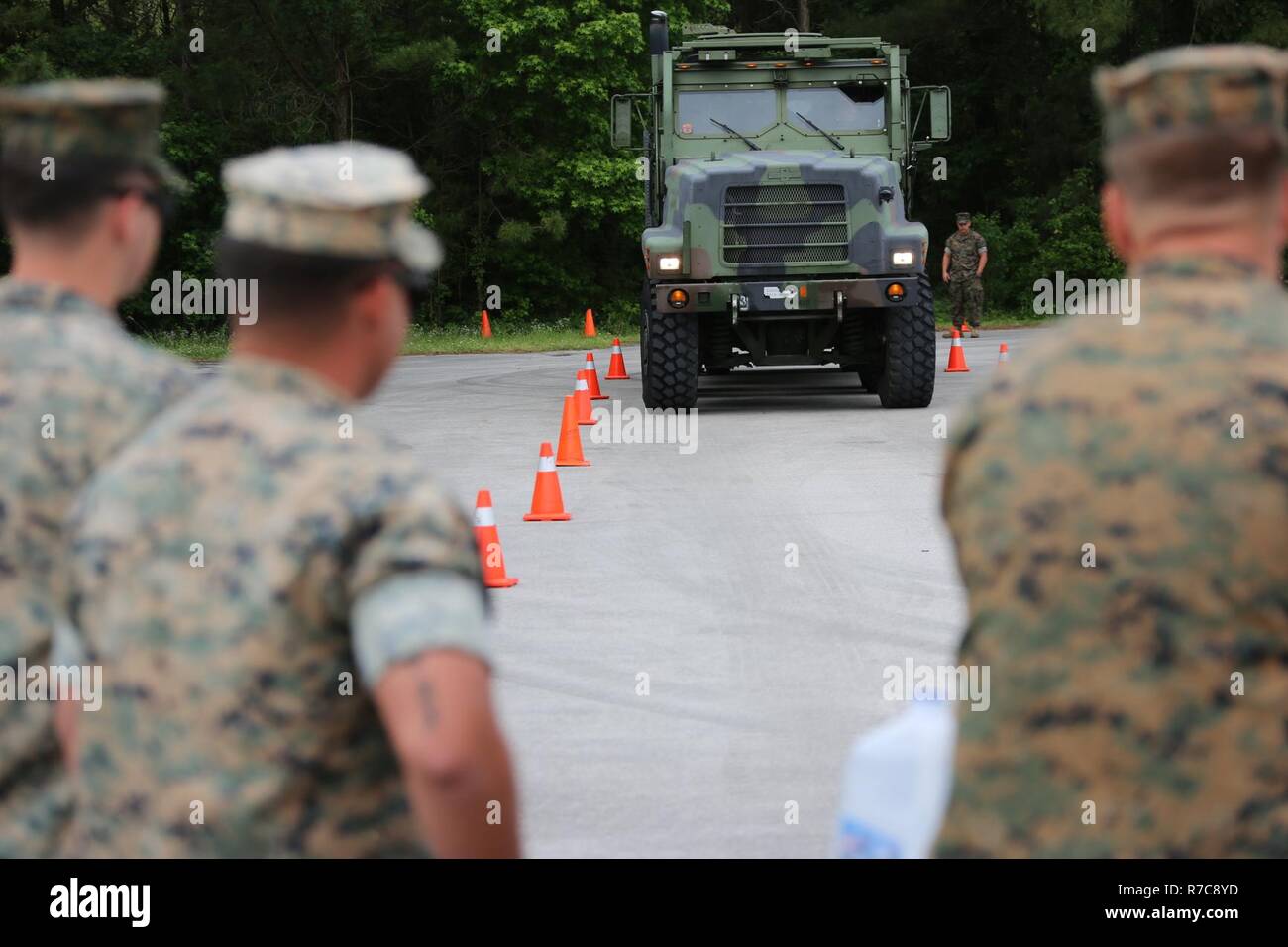 Marine transport operators observe a fellow student operating a M970 ...