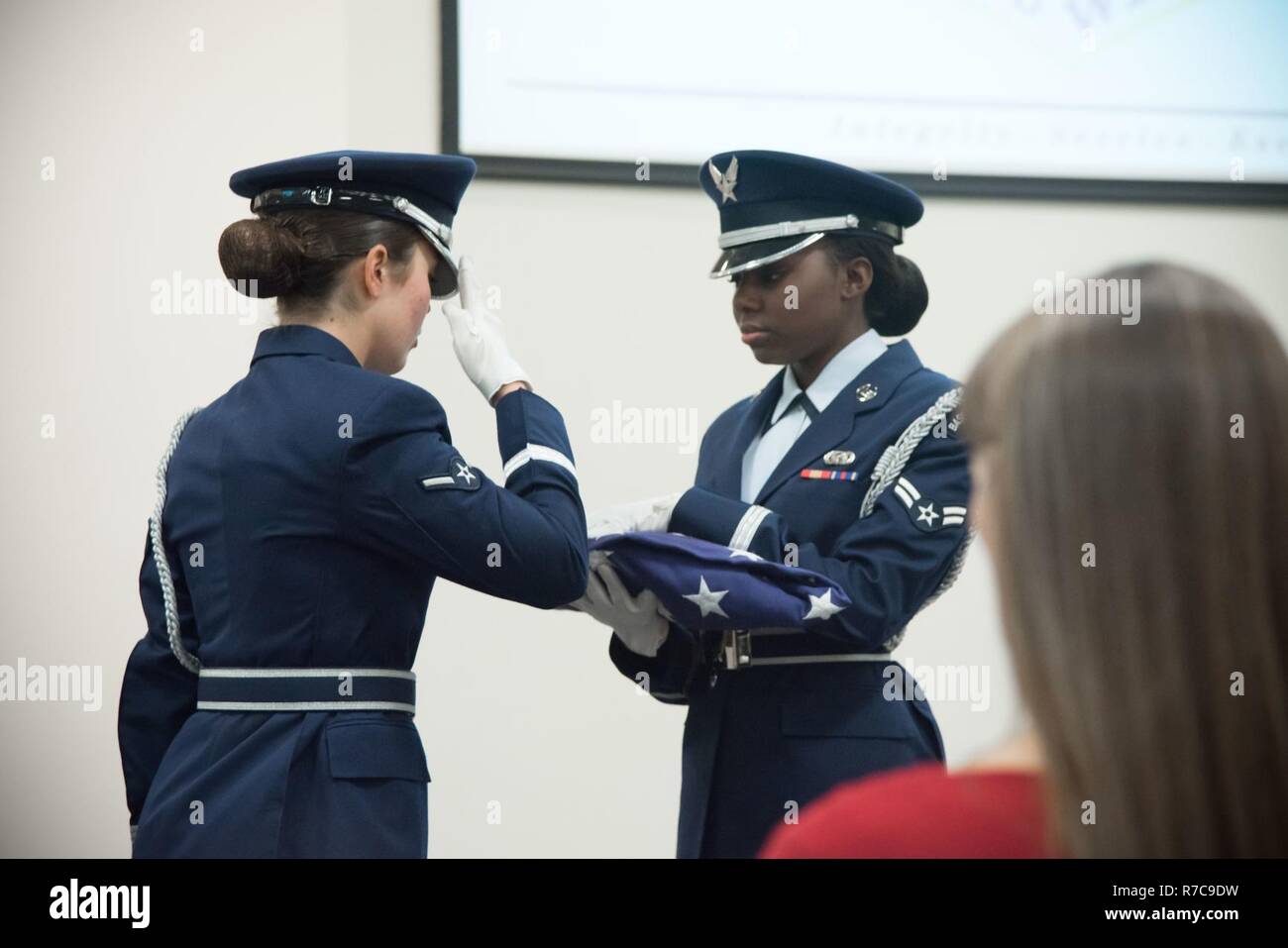 Members of the Keesler Honor Guard conduct a flag folding ceremony ...