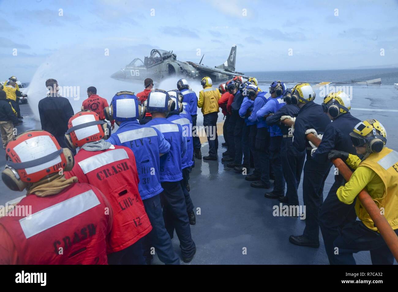 PACIFIC OCEAN (May 9, 2017) Sailors hose down an AV-8B Harrier during a ...