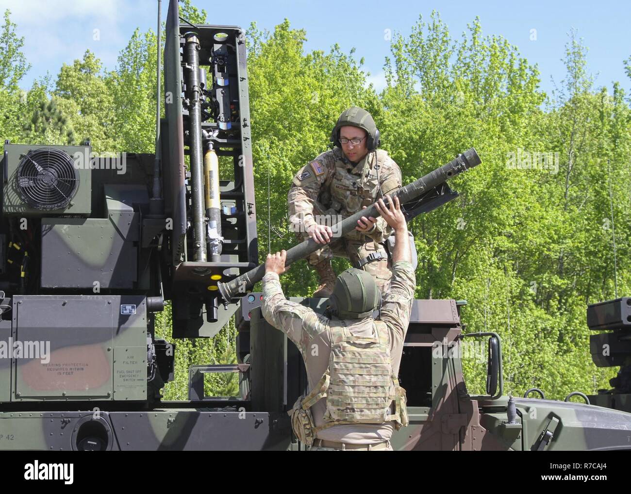 Staff Sgt. Josh Robinson (bottom), an air and missile defense ...