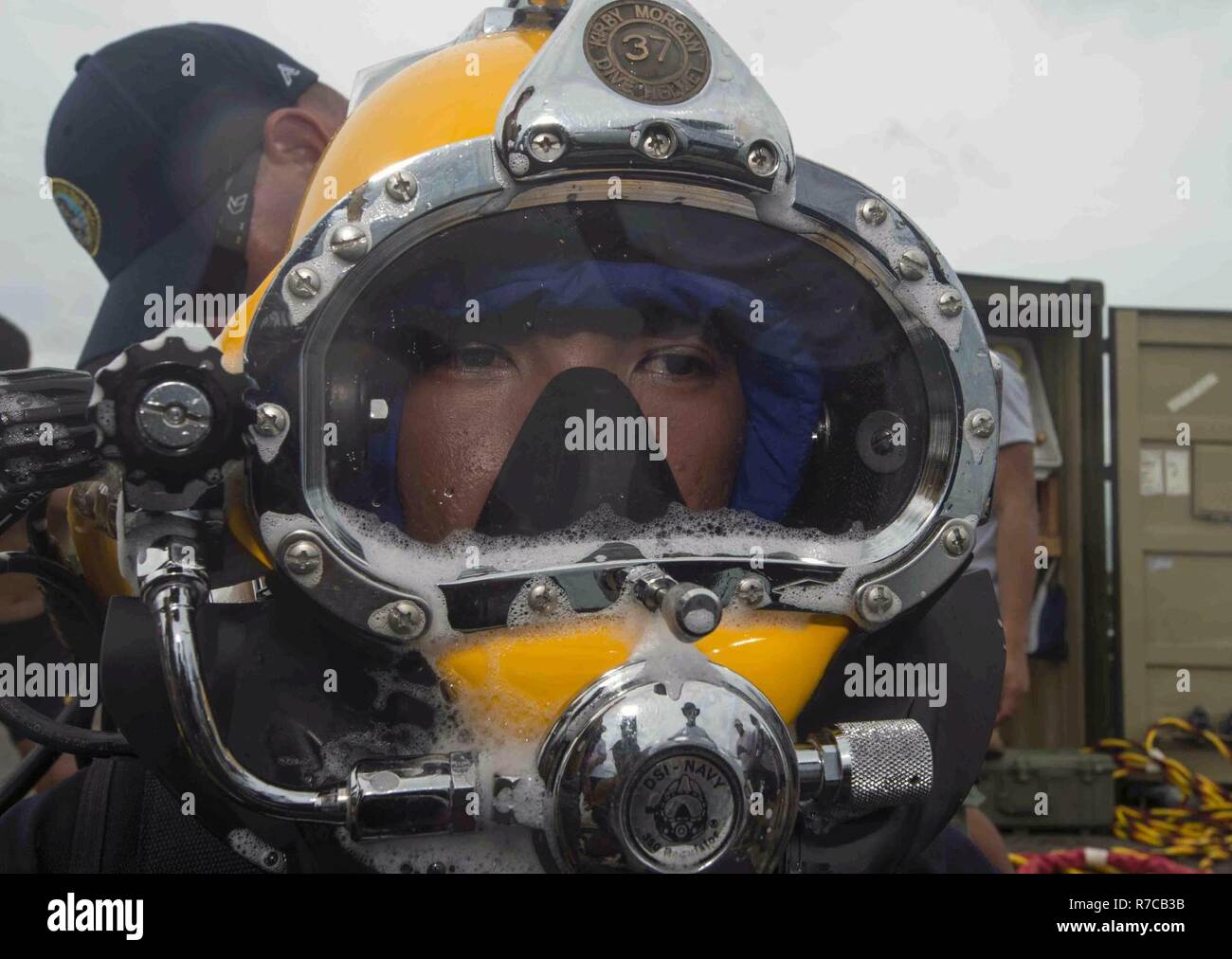 A Philippine Sailor prepares his gear before an underwater surface ...