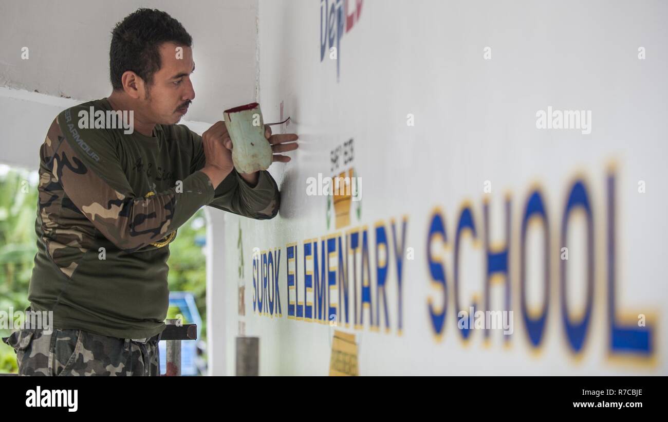 Philippine Navy Engineer Aide 3rd Class Francis Dairo paints a Surok ...