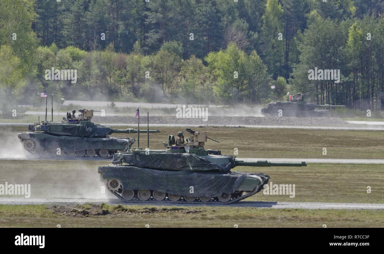 The U.S. tank platoon maneuvers through the offensive live-fire ...