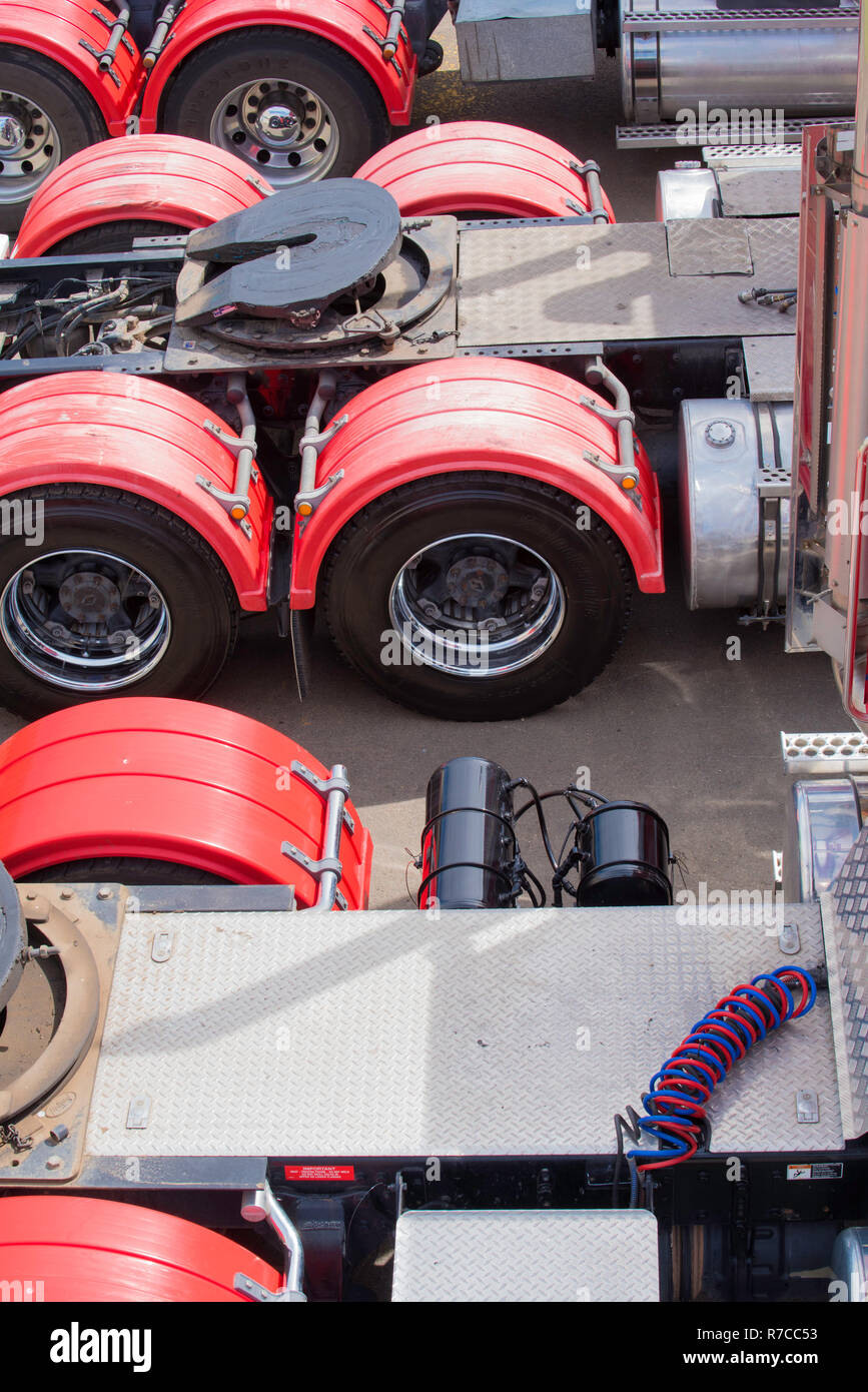 A partial view of three generic 18 wheeler prime mover trucks from ...
