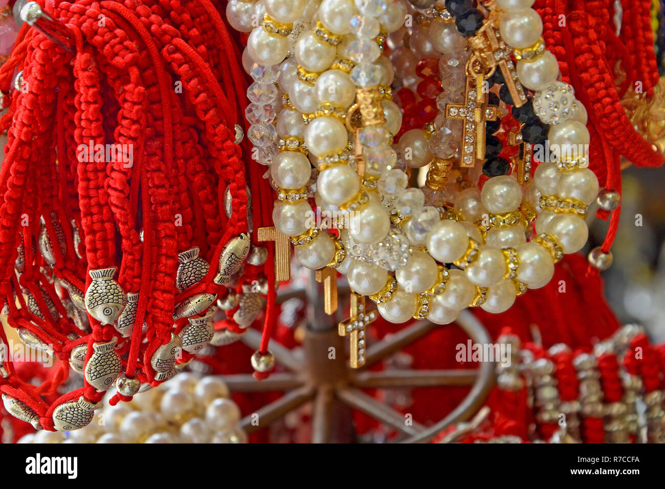 Bracelet braided from red thread and cross. talisman against the evil ...