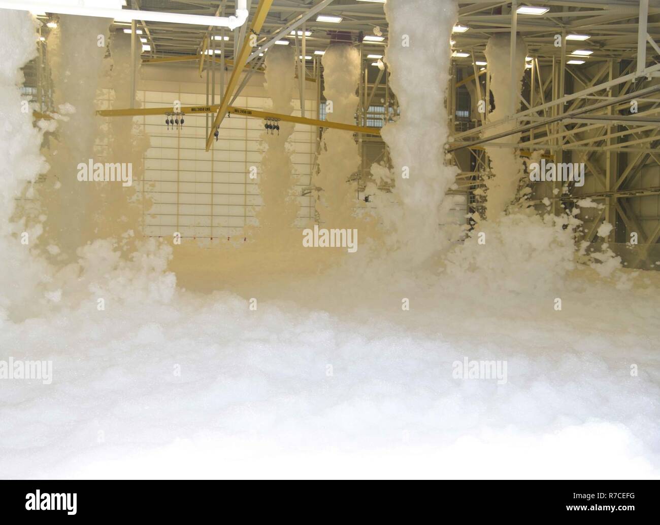 Foam from a fire suppression system fills a KC-46 Pegasus hangar during ...
