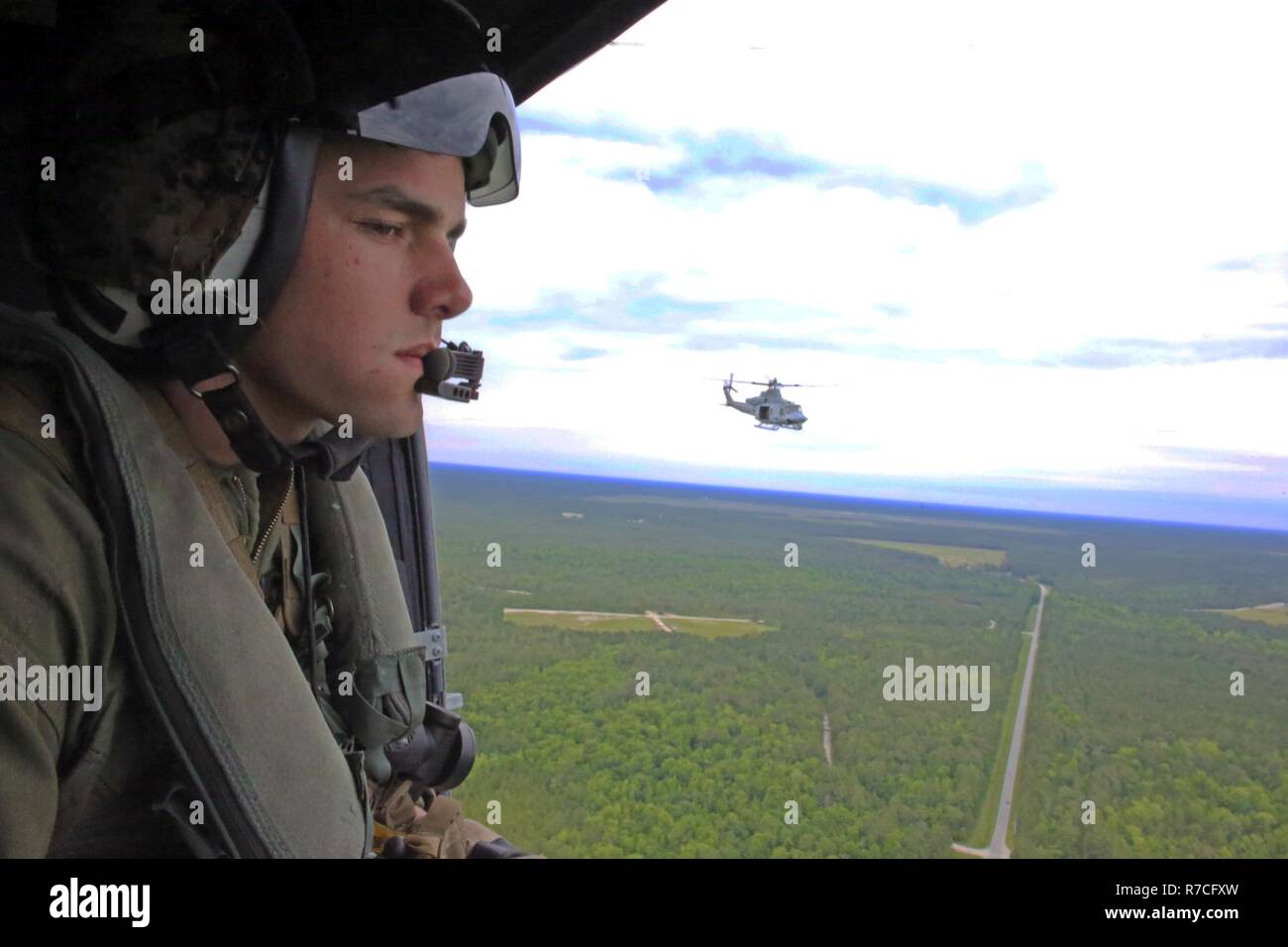 A Marine fast-ropes from a UH-1Y Venom helicopter during a fast-rope ...