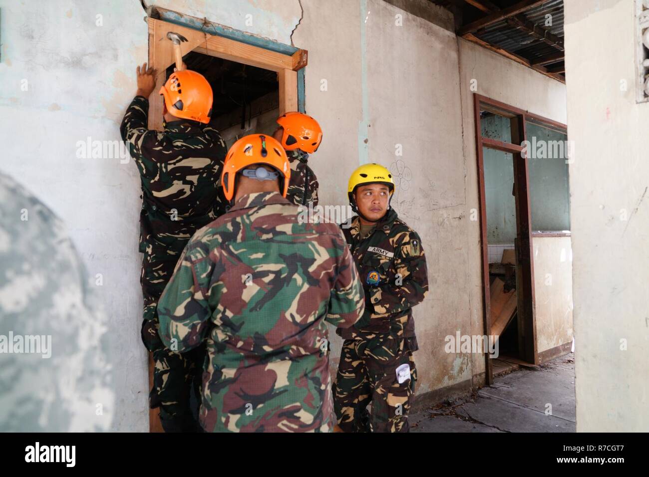 Members of the Armed Forces of the Philippines finish constructing a ...