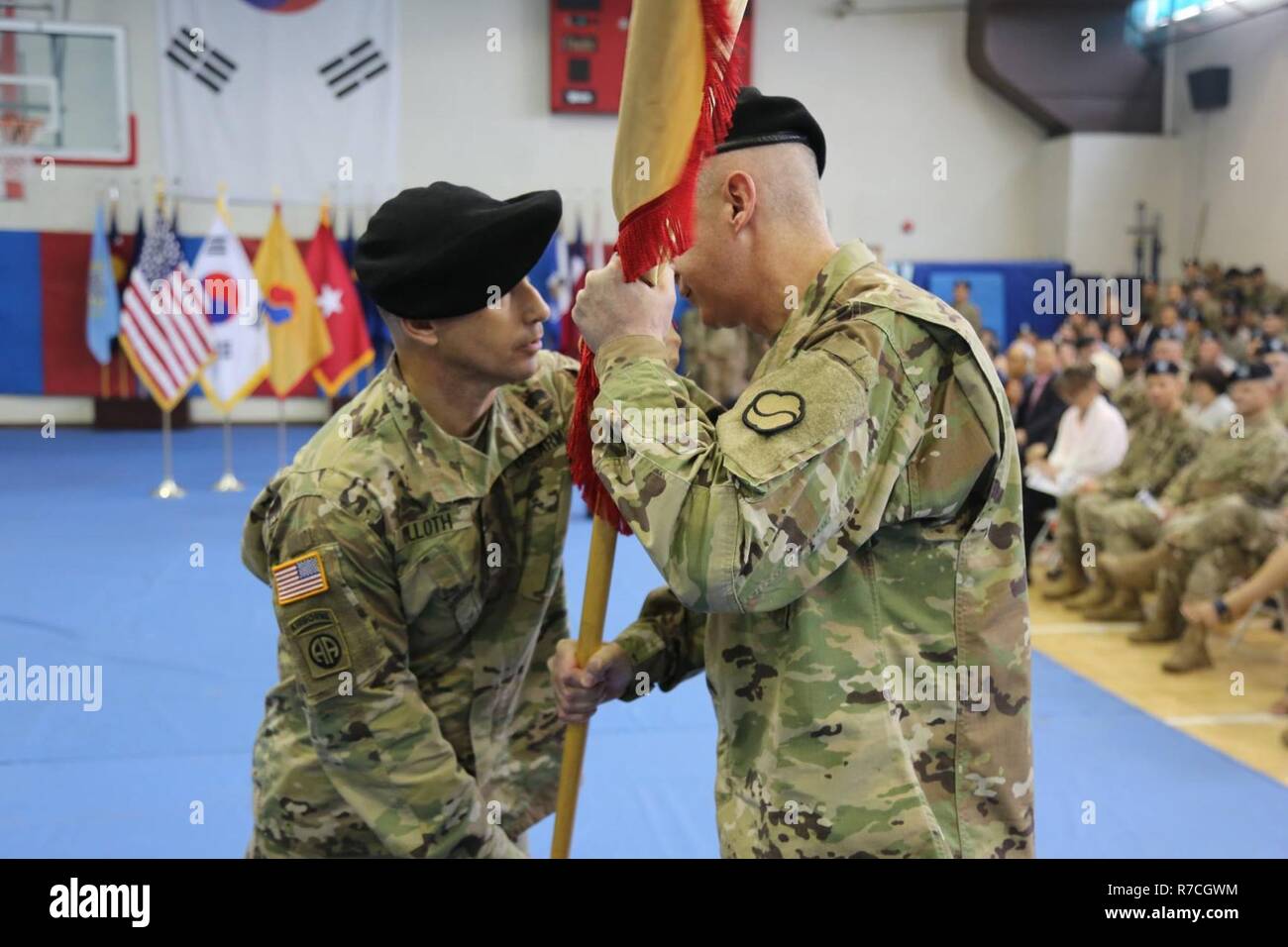 Command Sgt. Maj. Joe M. Ulloth passes the unit colors to Brig. Gen ...