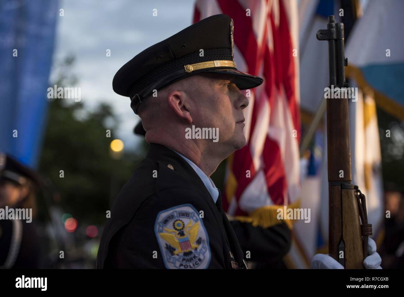 A member of the United States Park Police Honor Guard presents arms ...