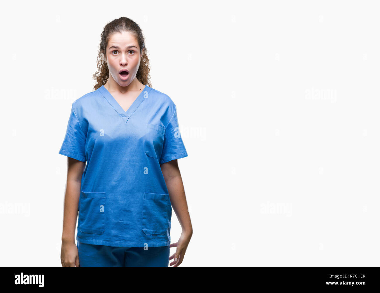 Young brunette doctor girl wearing nurse or surgeon uniform over ...