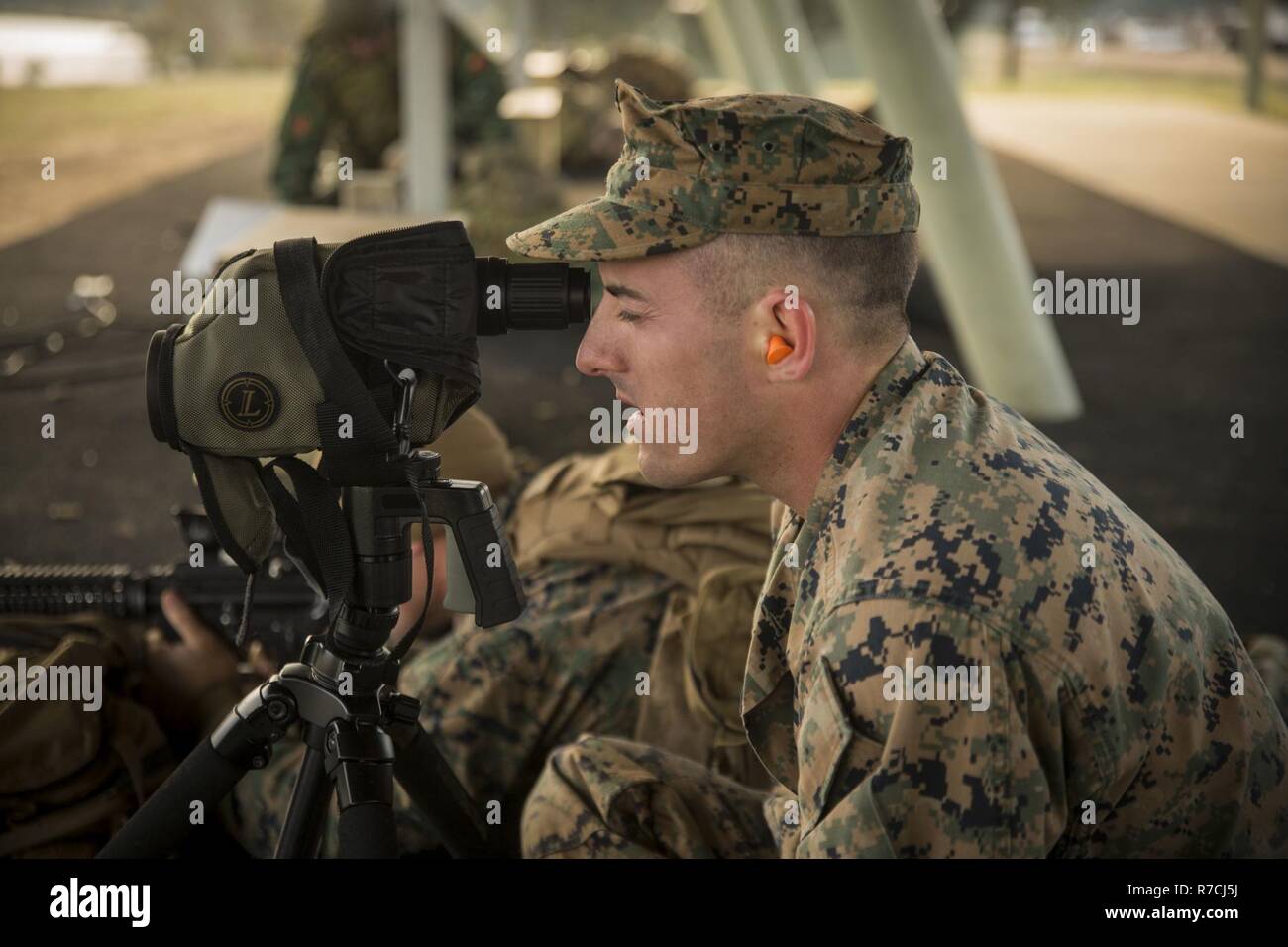 Sgt. Johnathon Solinsky spots for a Marine calibrating an M40A6 sniper ...