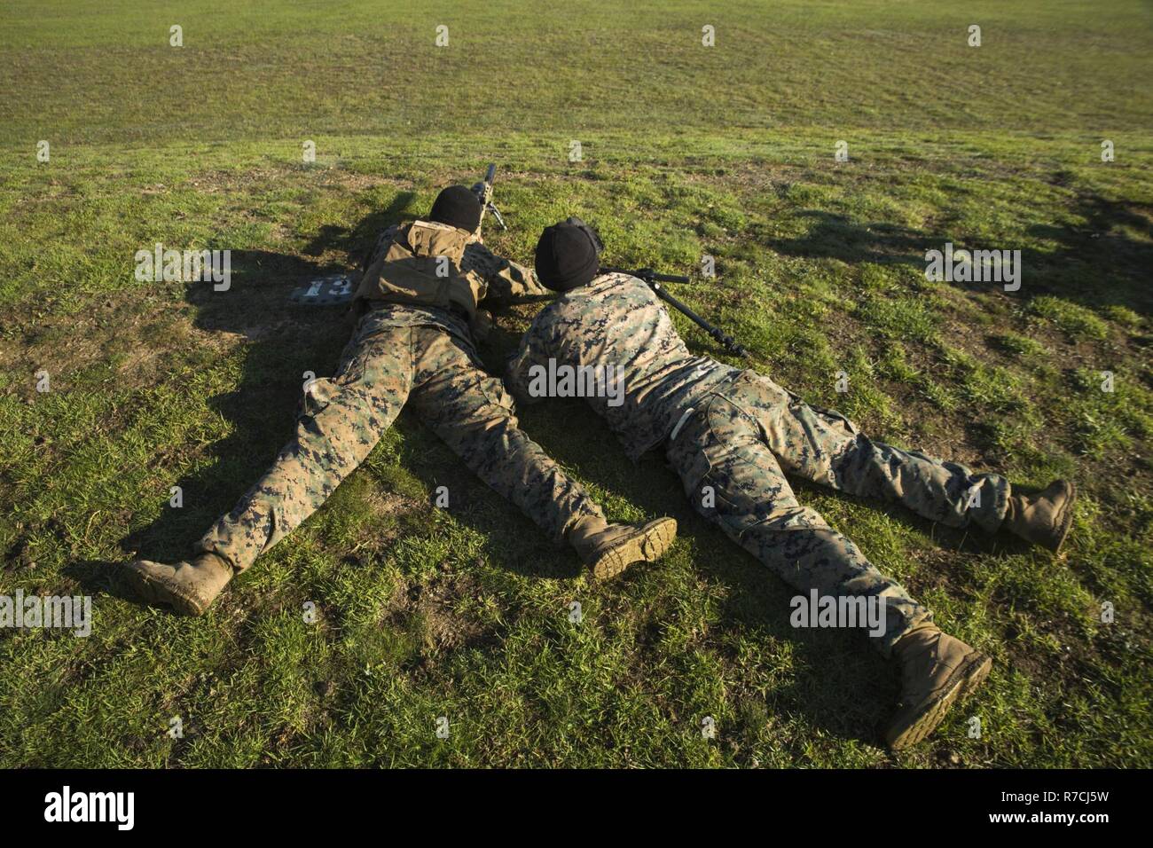 Lance Cpl. Colton Rine (left) and Sgt. Damian Knight (right) focus to ...