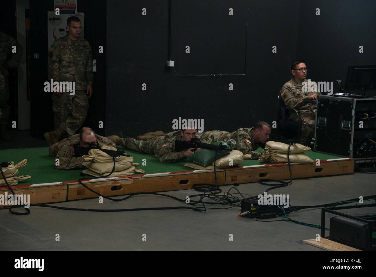 U.S. Soldiers train using the Engagement Skills Trainer II, EST II, at ...