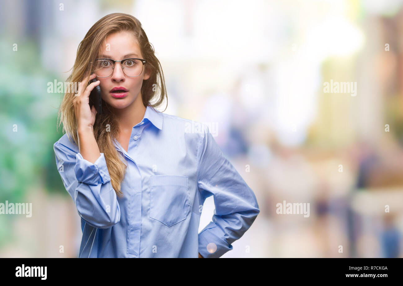 Young beautiful blonde business woman calling using smartphone over ...