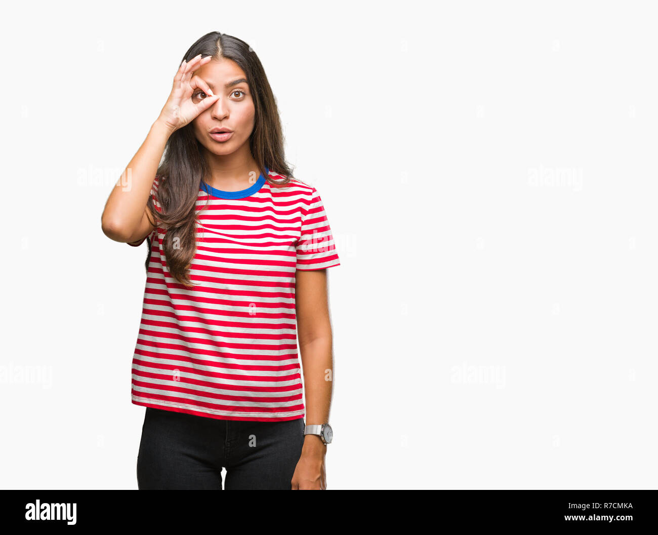 Young beautiful arab woman over isolated background doing ok gesture ...
