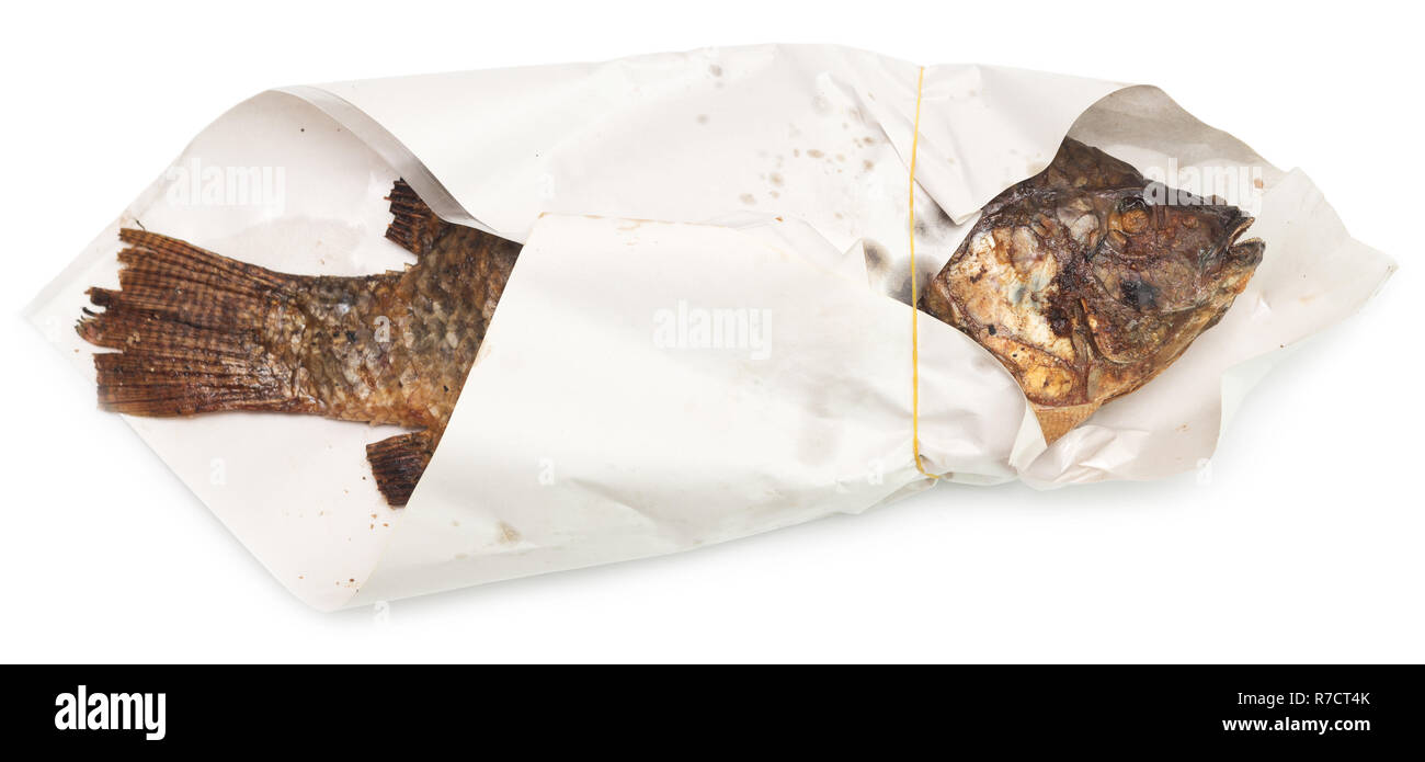 Grilled fish in a paper bag isolated on white background Stock Photo ...