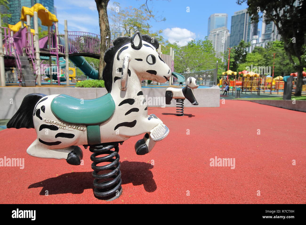 Horse ride at KLCC park in Kuala Lumpur Malaysia Stock Photo - Alamy