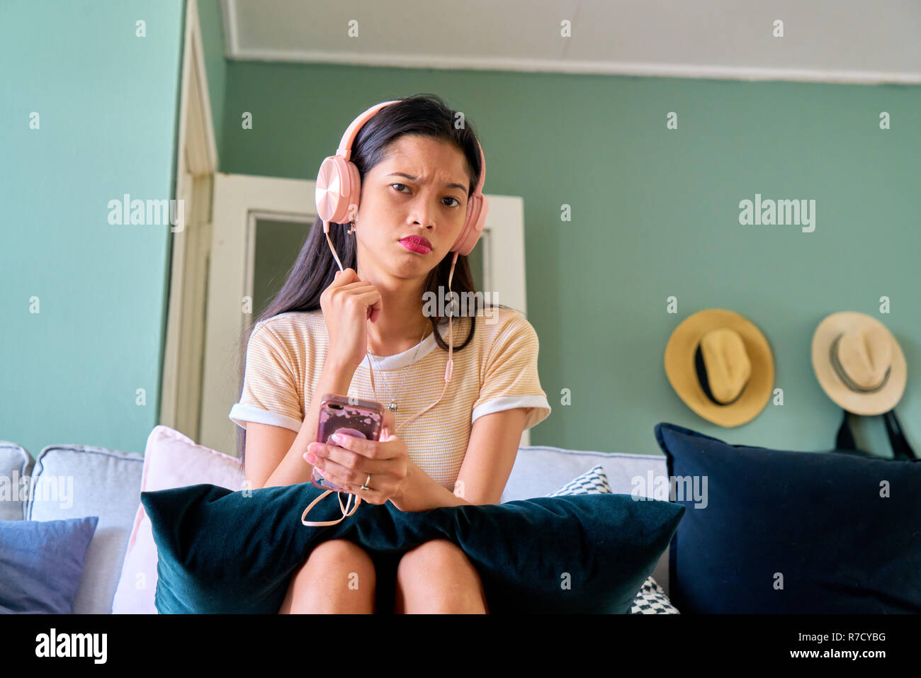 Beautiful woman posing - sitting, listening music, facial expression ...