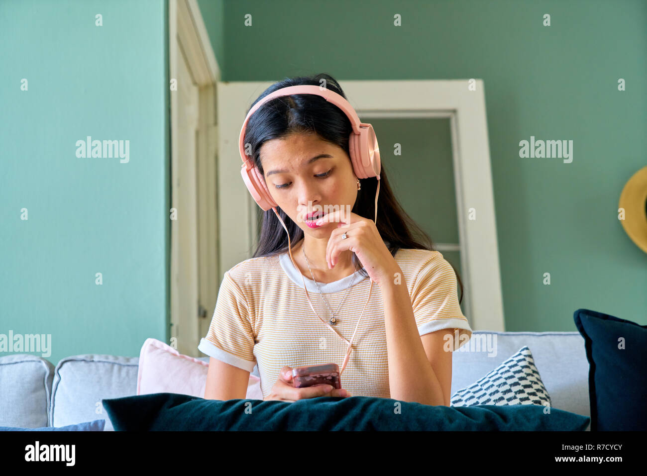 Beautiful woman posing - sitting, listening music, shocked and facial ...