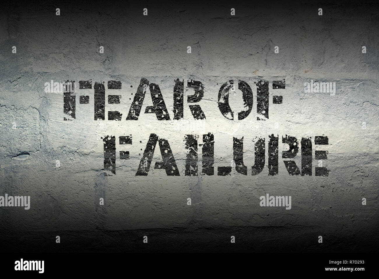 fear of failure stencil print on the grunge white brick wall Stock ...