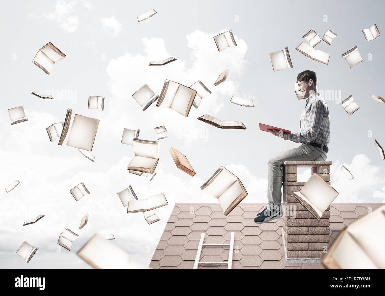 Man reading book and many of them flying in air Stock Photo - Alamy