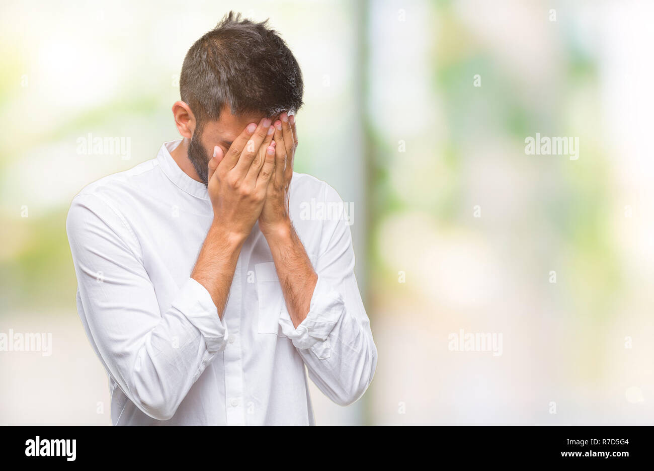 Adult hispanic man over isolated background with sad expression ...