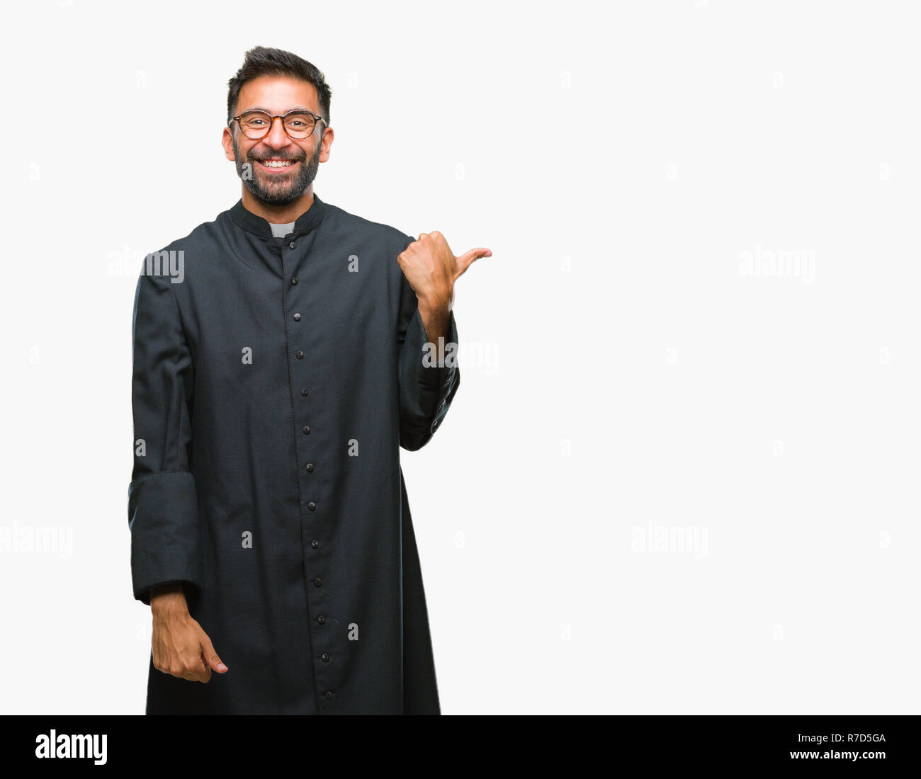 Adult hispanic catholic priest man over isolated background smiling ...