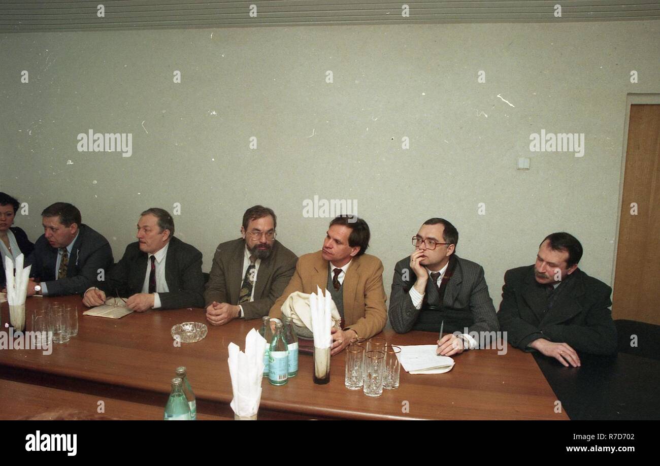 group of men sitting Stock Photo - Alamy