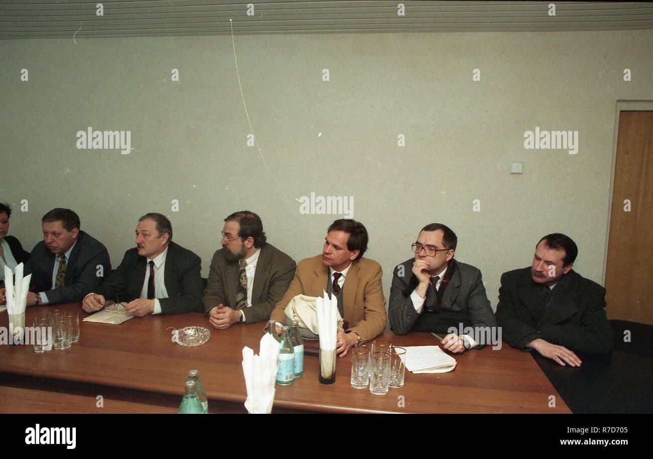 group of men sitting Stock Photo - Alamy