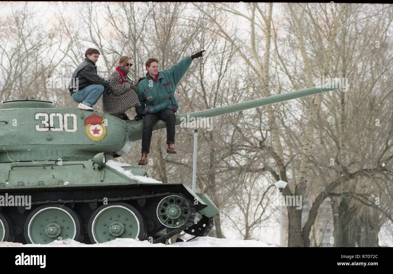 three people on tank Stock Photo - Alamy
