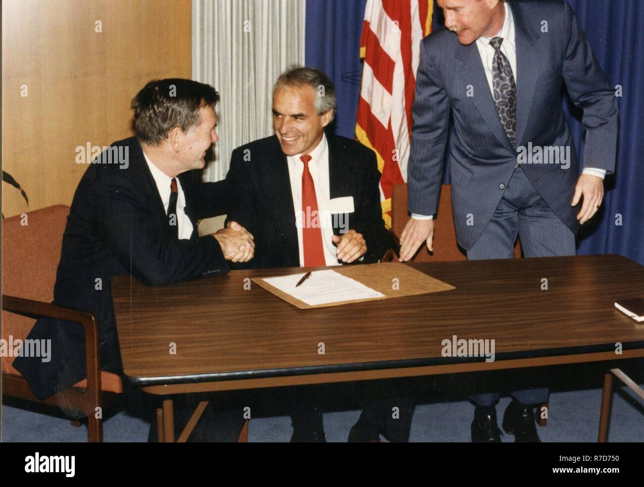 men talking and signing papers Stock Photo - Alamy