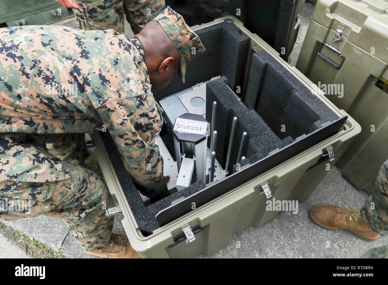U.S. Marine Corps Cpl. André T. Peterson Jr., a combat photographer ...