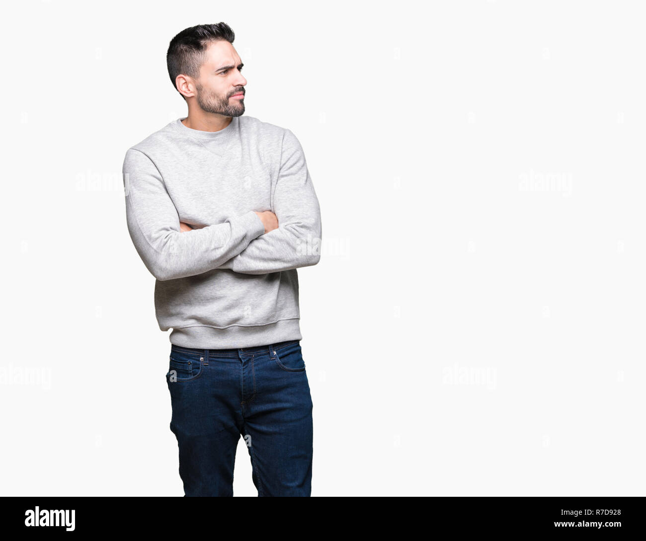 Young man arms folded side Cut Out Stock Images & Pictures - Alamy