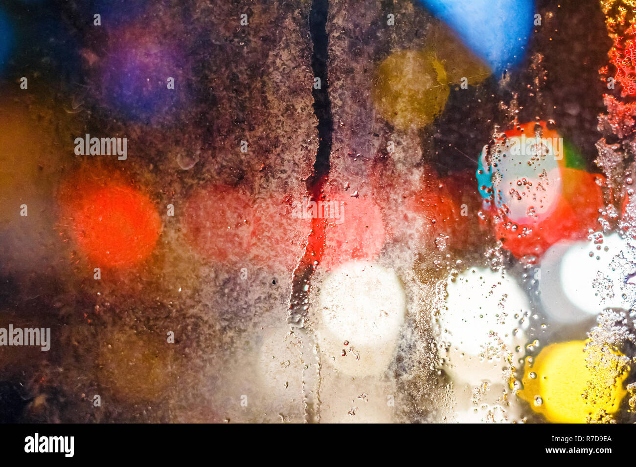 rain drops on window with blurry background Stock Photo - Alamy
