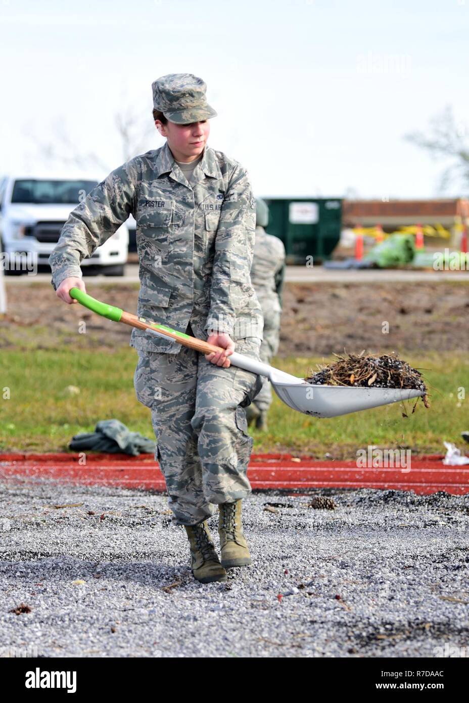 Airman Ashby Foster, Task Force Talon II member, shovels debris from ...