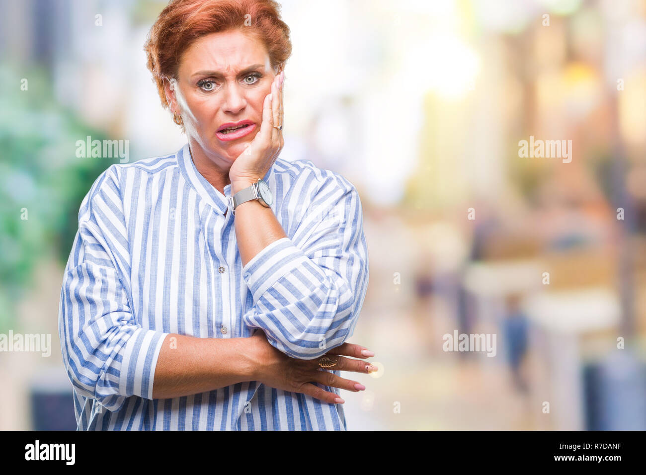 Atrractive senior caucasian redhead woman over isolated background ...